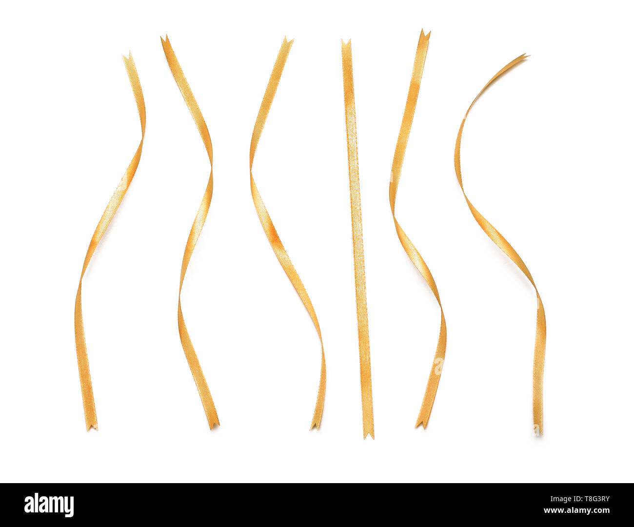 Curly golden ribbons on white background Stock Photo - Alamy