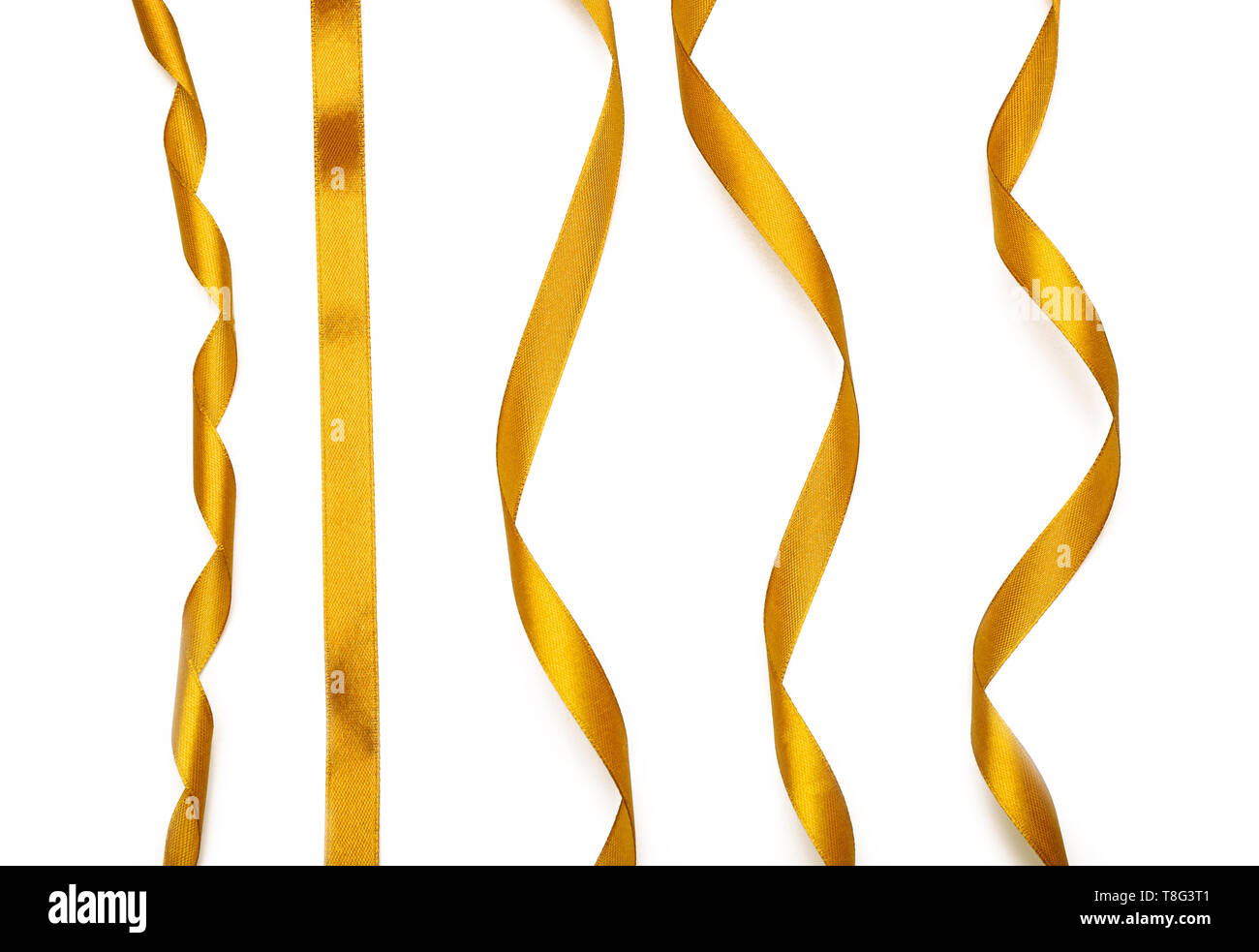 Curly golden ribbons on white background Stock Photo - Alamy
