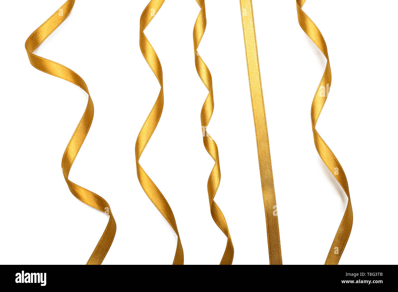 Curly golden ribbons on white background Stock Photo - Alamy