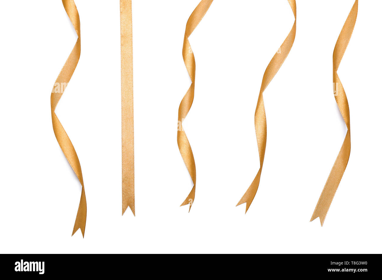 Curly golden ribbons on white background Stock Photo - Alamy