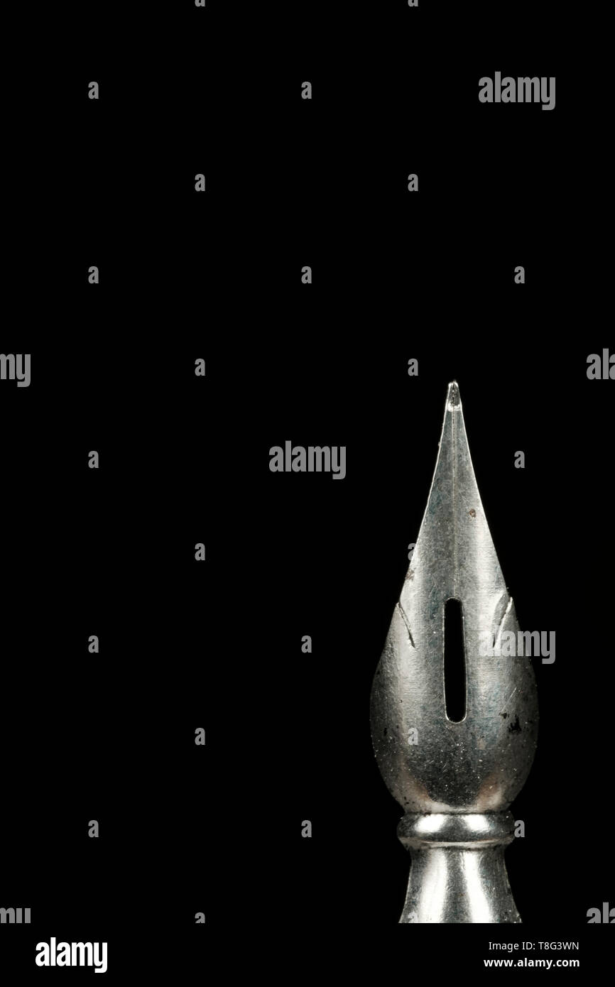 Macro image of a pen nib against a black background Stock Photo - Alamy