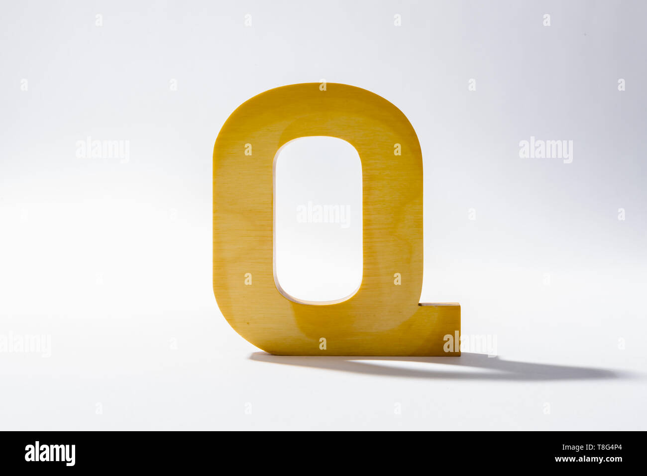 Wooden Alphabet Q and Shadow Reflection Stock Photo - Alamy