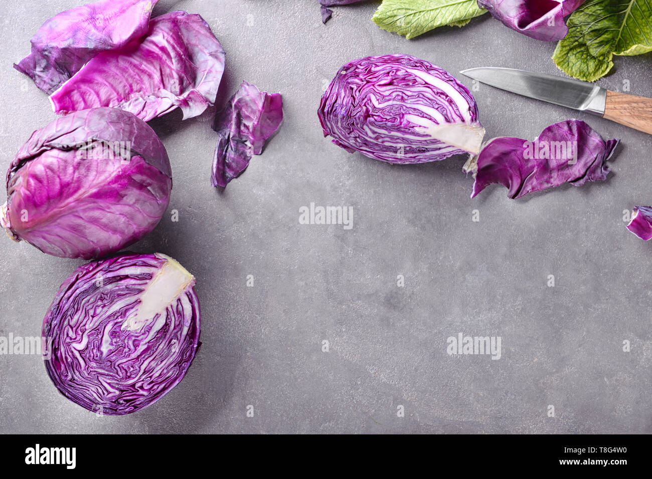 Whole and cut red cabbage on grey table Stock Photo - Alamy