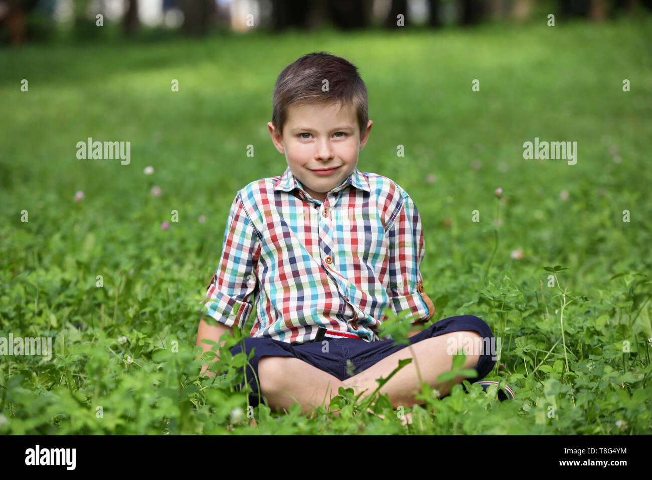 Cute little boy in park on summer day Stock Photo - Alamy