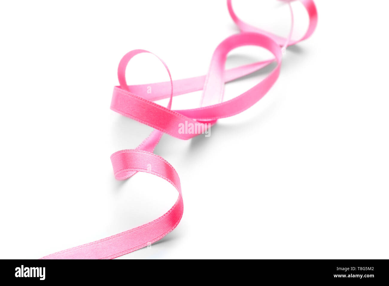 Pink ribbon on white background Stock Photo - Alamy