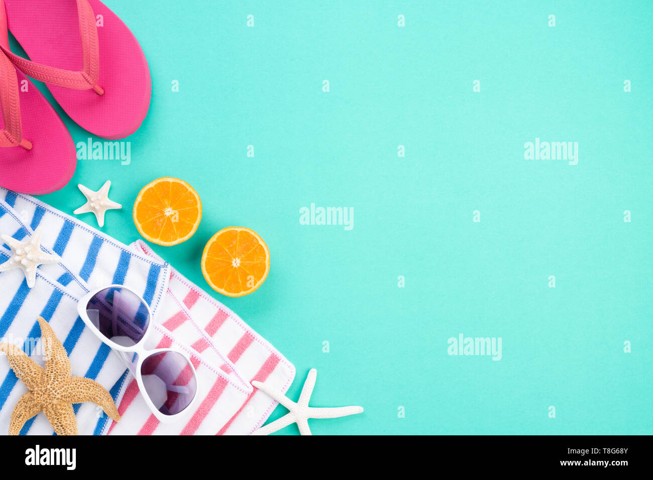 Beach accessories sunglasses, flip flop starfish, a half piece of ...