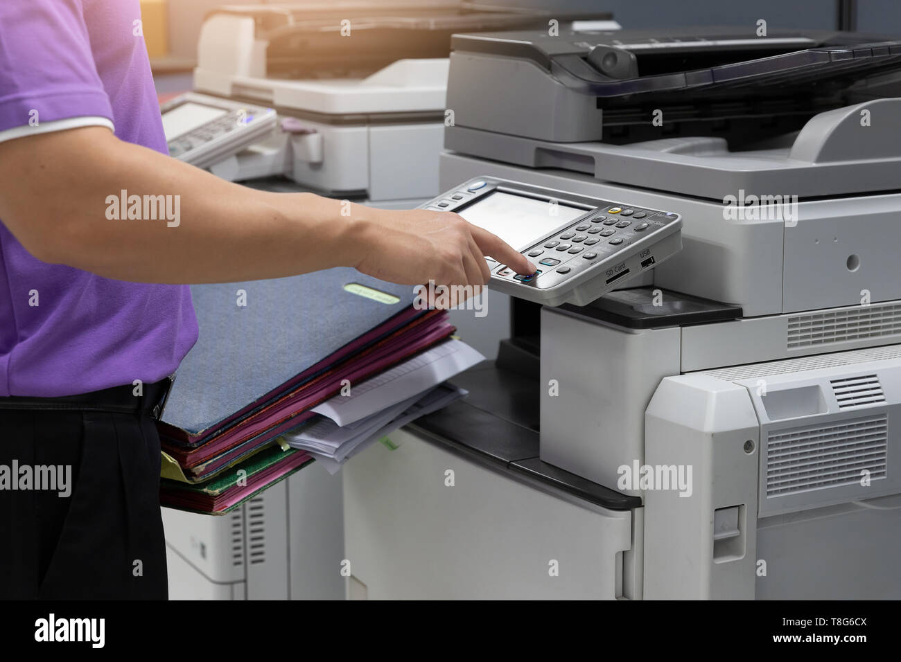 Using copier in busy office hi-res stock photography and images - Alamy