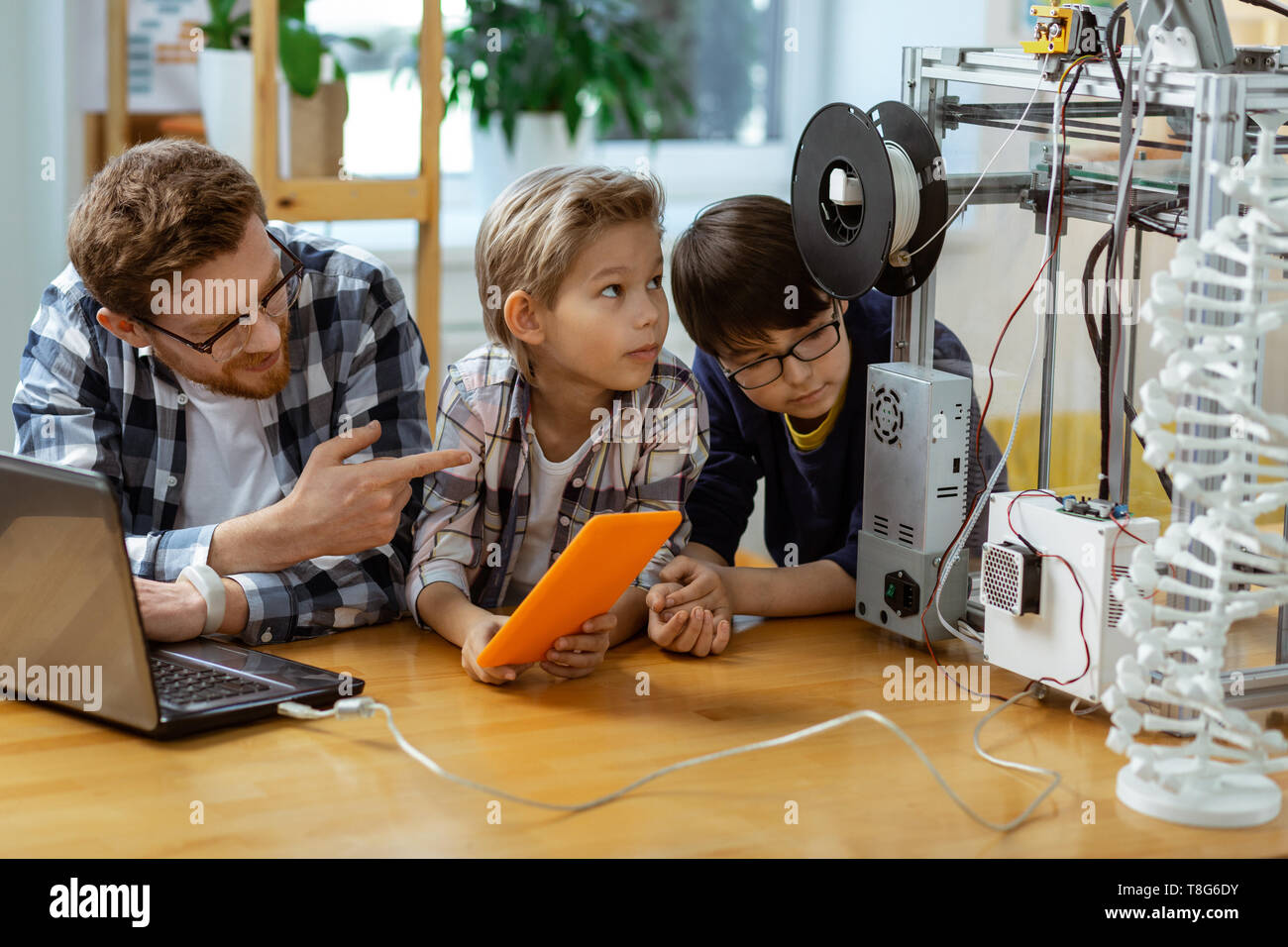 Attentive little engineers checking process of creating 3d-models Stock ...