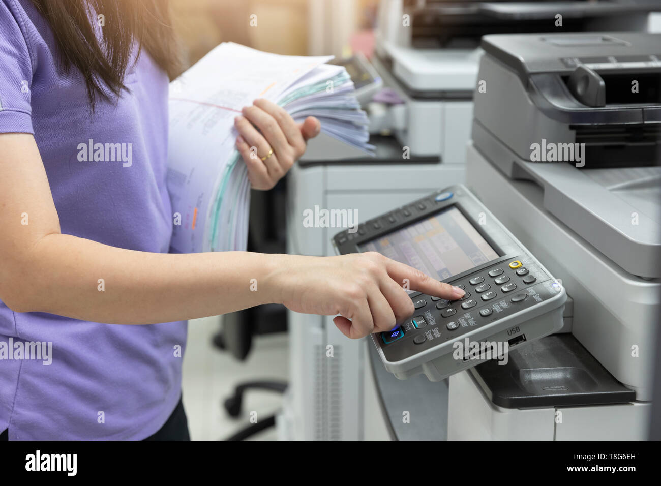 Using copier in busy office hi-res stock photography and images - Alamy
