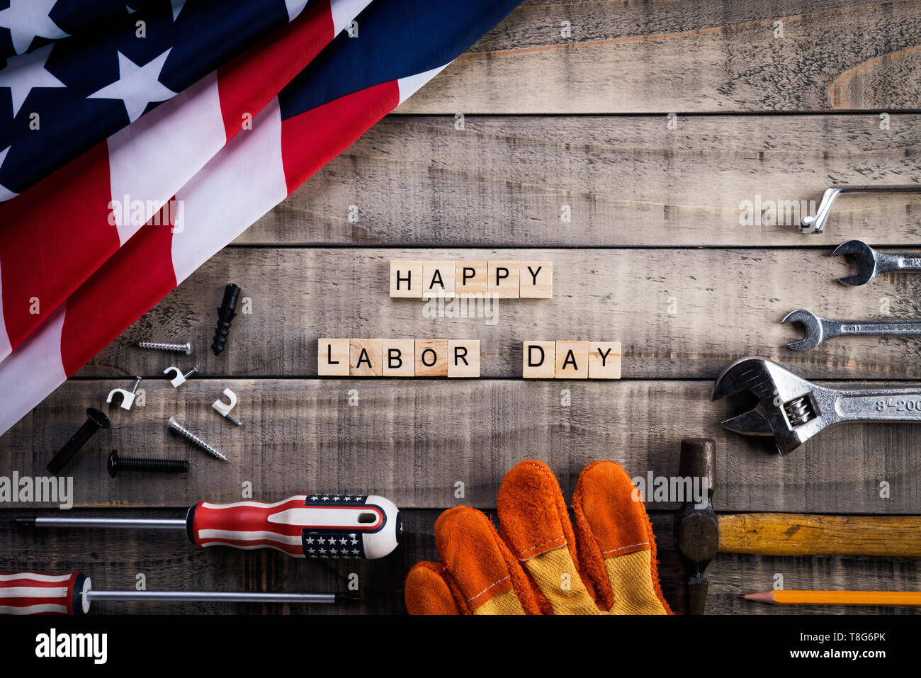 Labor Day, USA America flag with many handy tools on wooden background ...