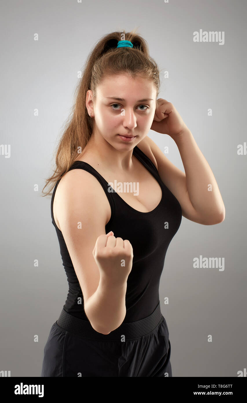 Female bare knuckle fighter on gray background Stock Photo - Alamy