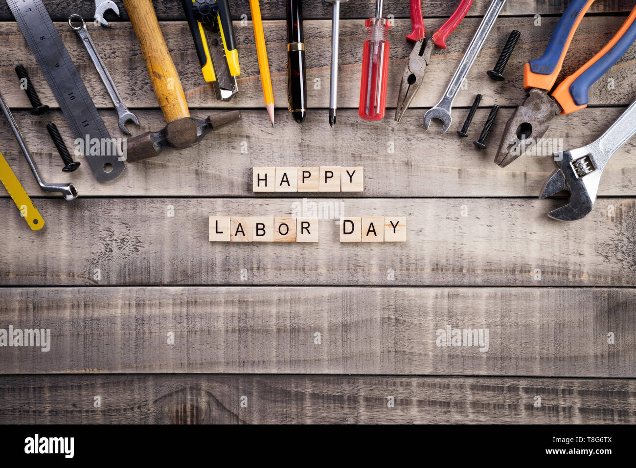 Labour Day, Wooden Block calendar with many handy tools on wooden ...