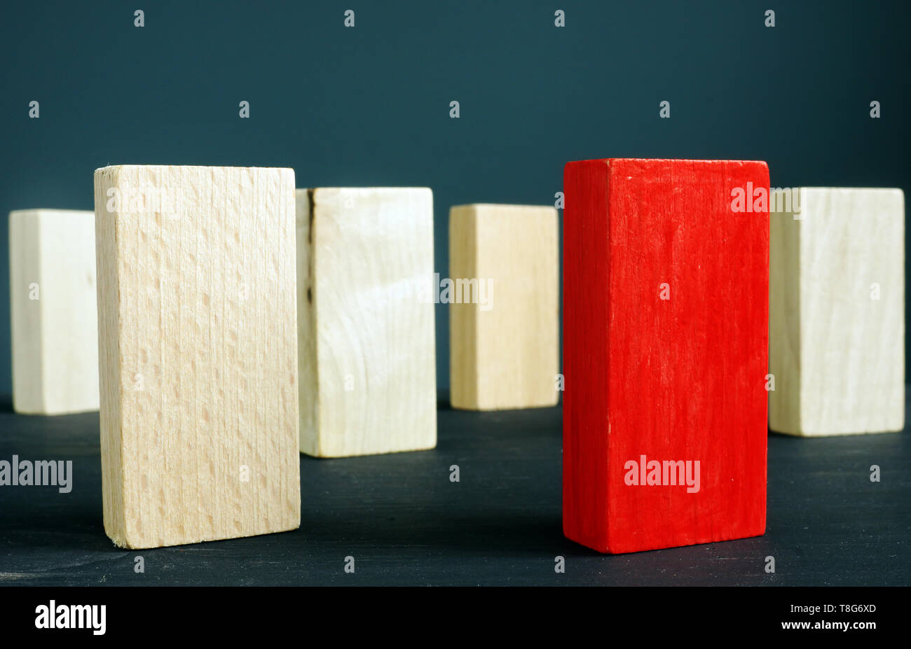 Different and unique concept. Red block and wooden blocks Stock Photo ...