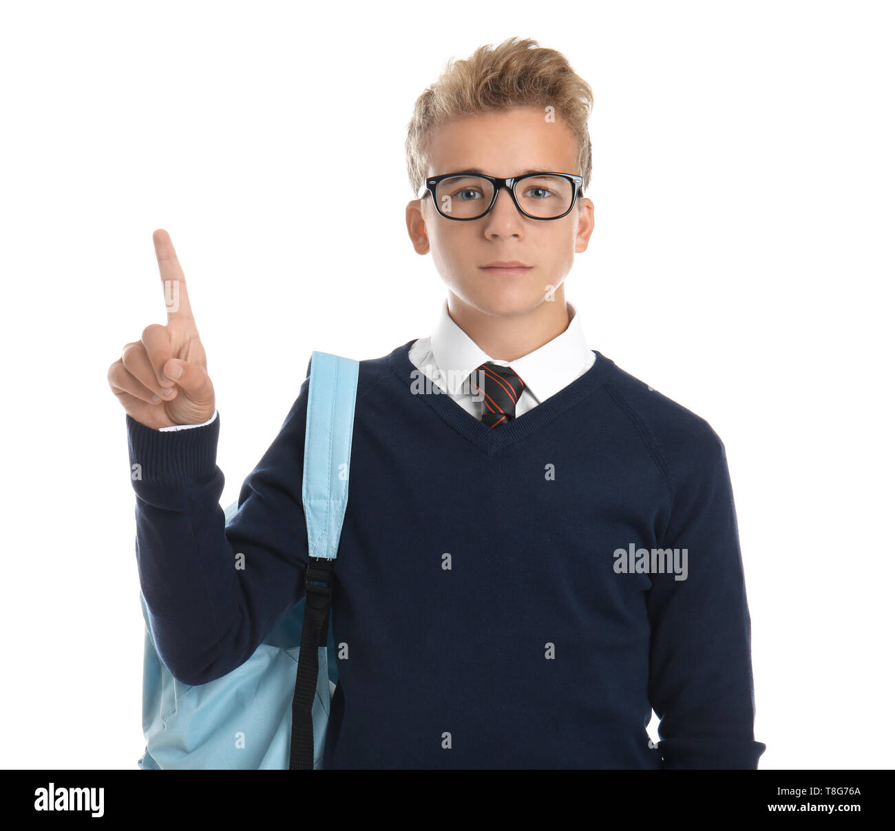 Teenage boy with backpack showing eureka sign on white background Stock ...