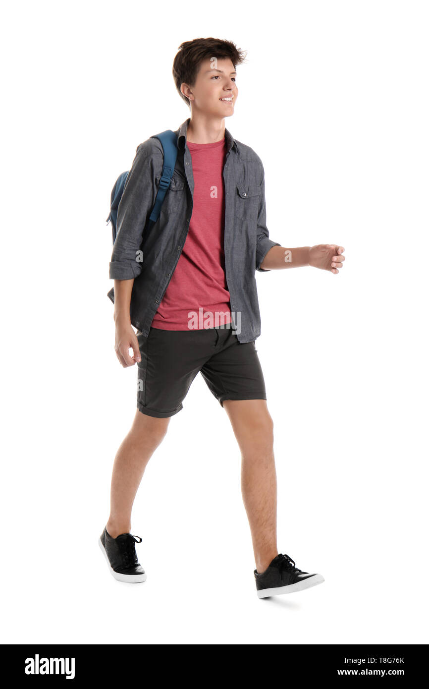 Teenage boy with backpack on white background Stock Photo - Alamy