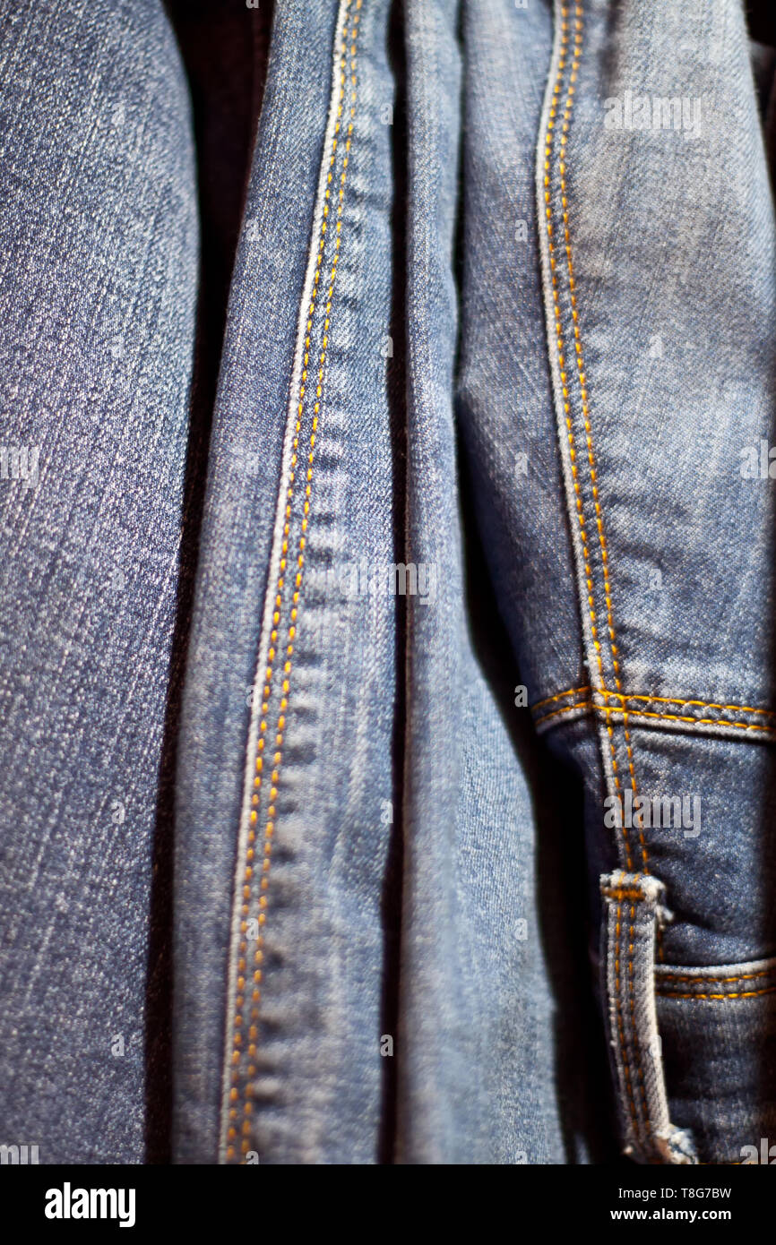 stack of various shades of jeans as background Stock Photo - Alamy