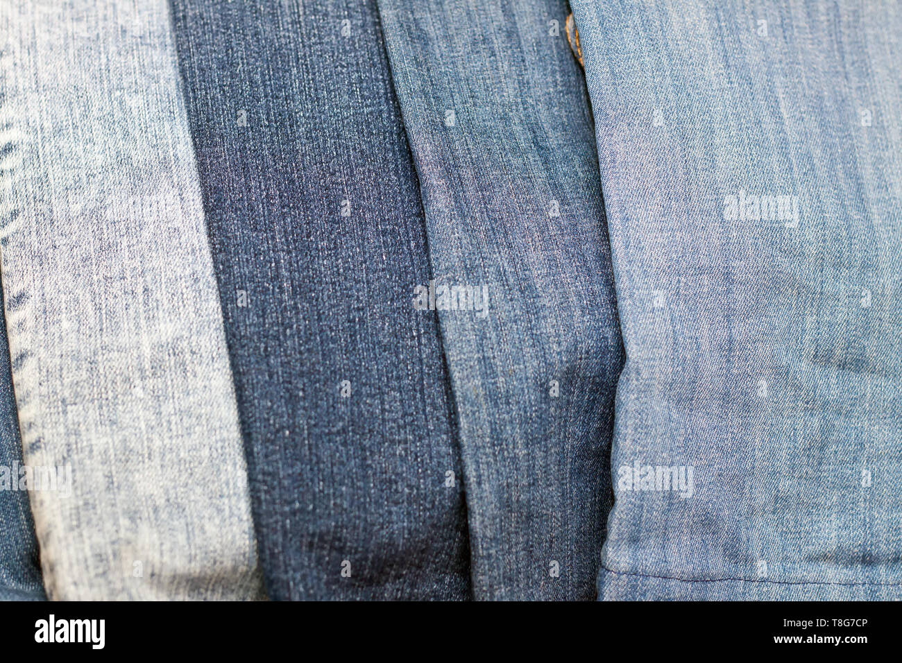 stack of various shades of jeans as background Stock Photo - Alamy