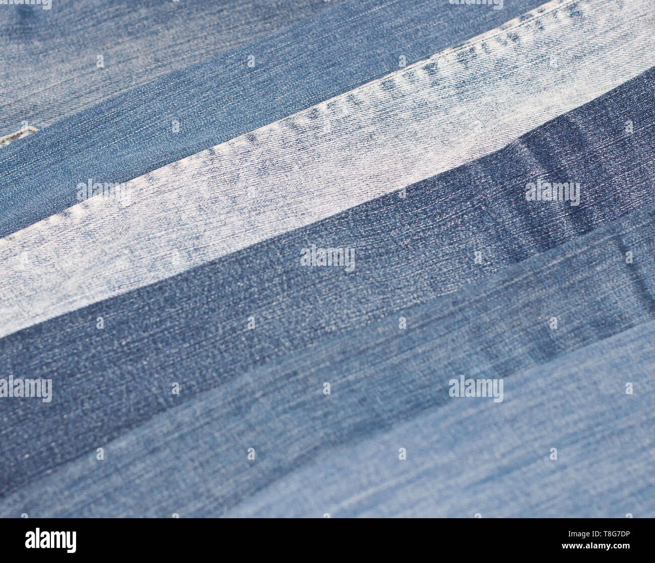 stack of various shades of jeans as background Stock Photo - Alamy