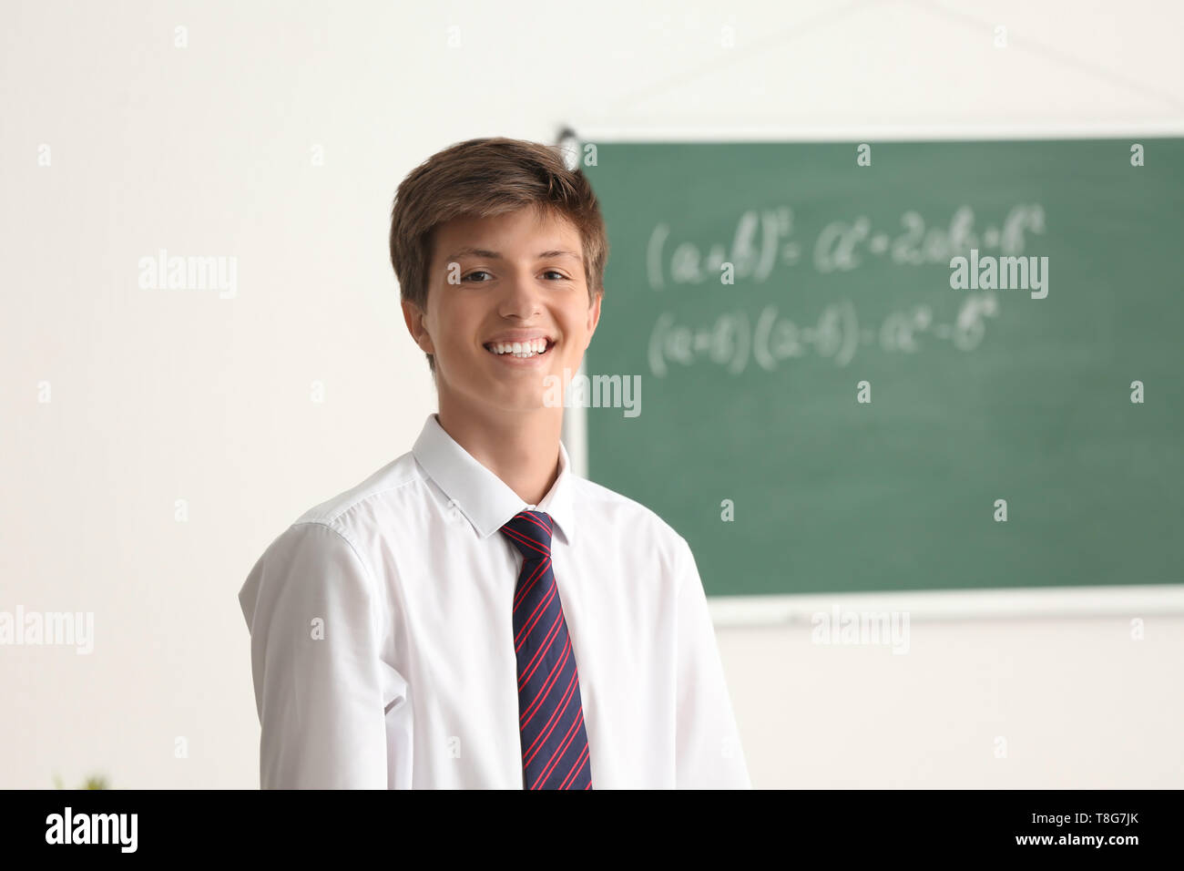 Teenage boy in classroom Stock Photo - Alamy