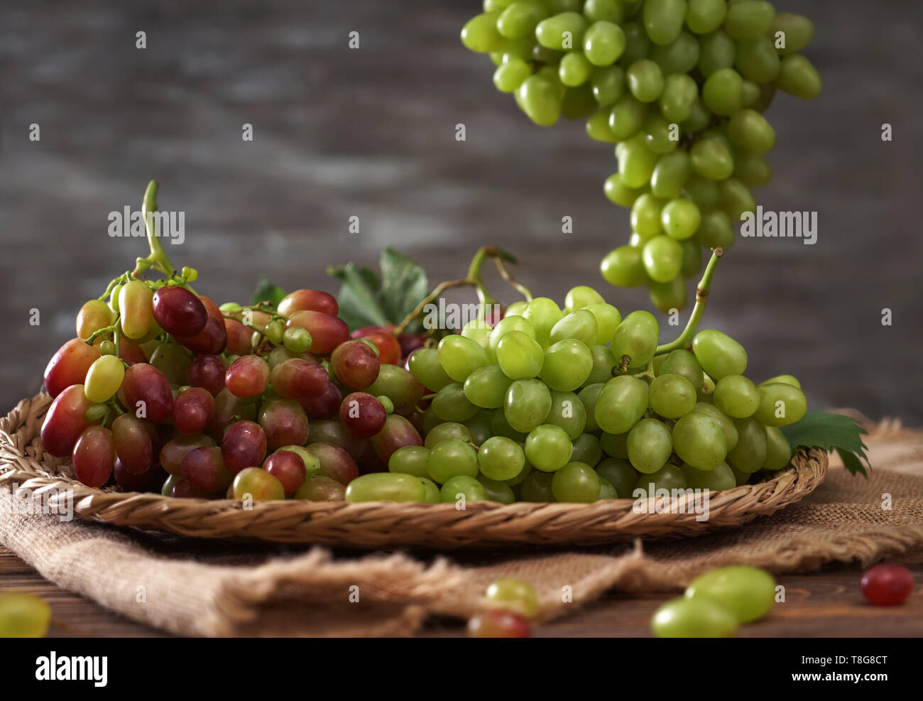 Fresh ripe grapes on wicker tray Stock Photo - Alamy