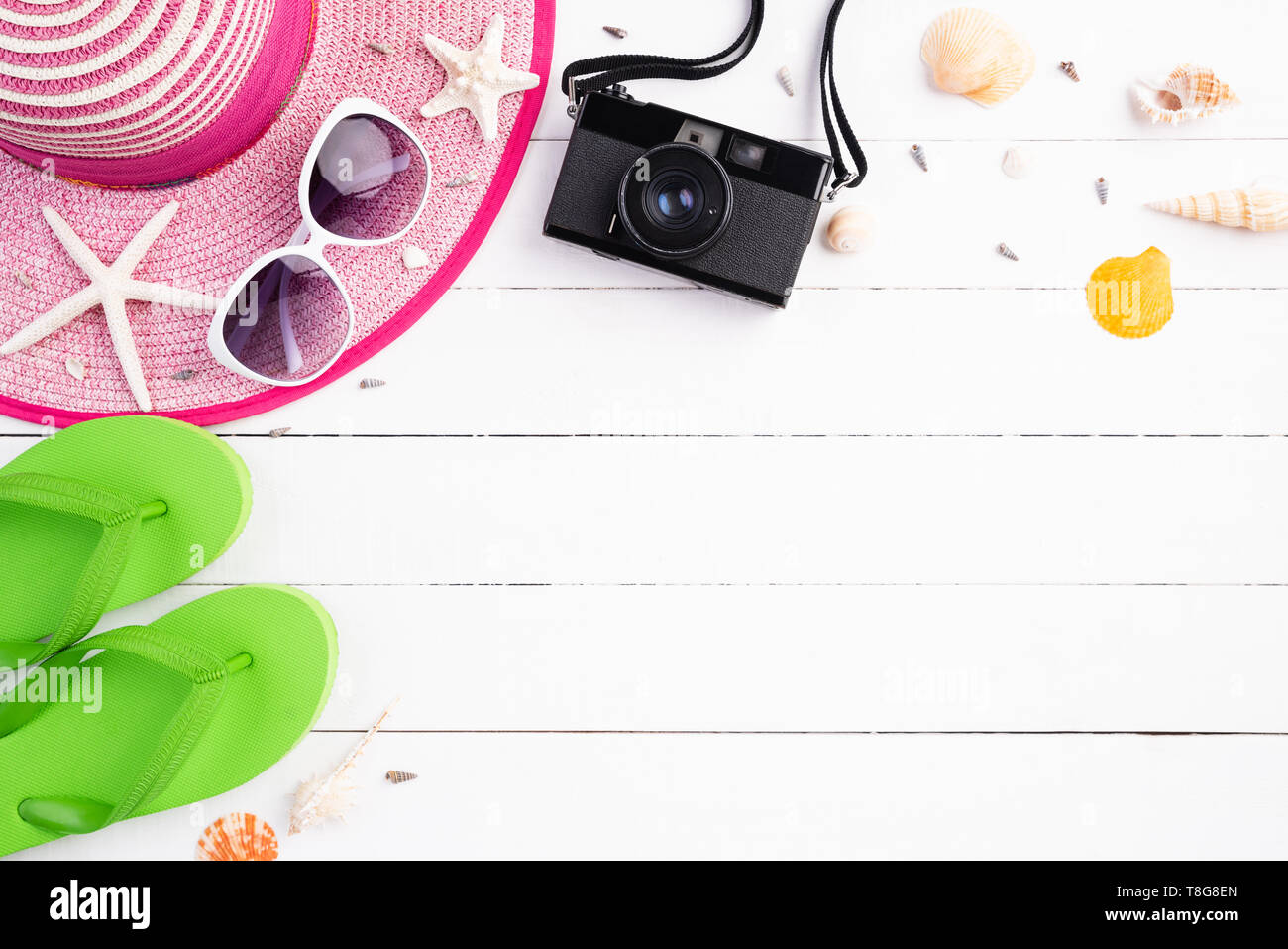 Beach accessories including flip flop, starfish, beach hat and sea ...