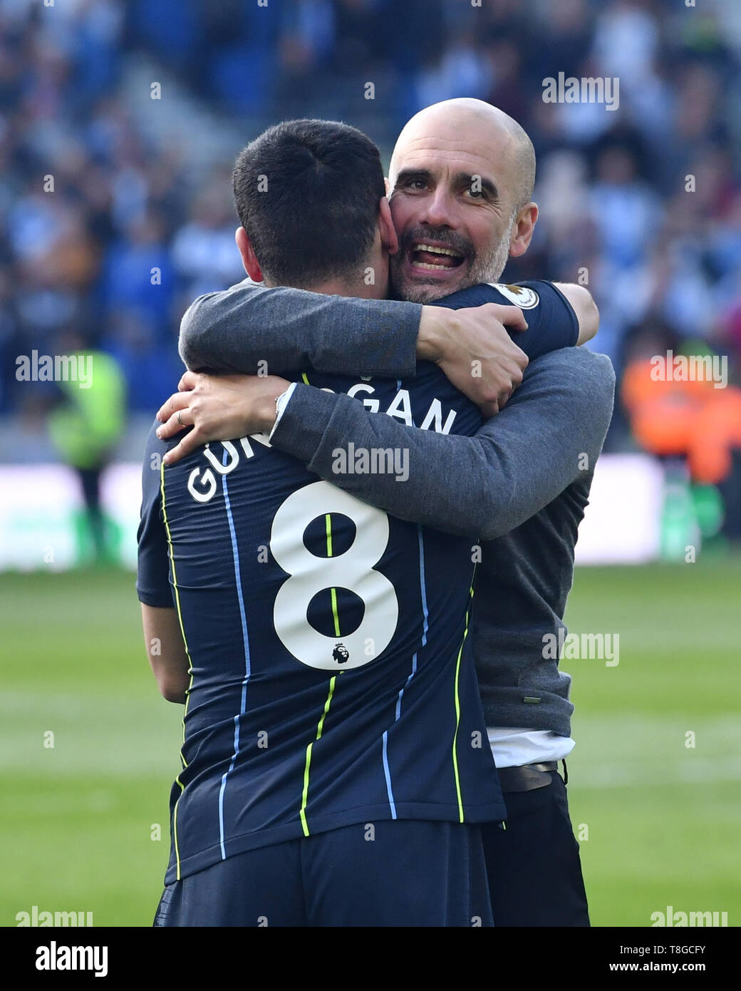 BRIGHTON, ENGLAND - MAY 12: Manchester City manager Pep Guardiola hugs ...