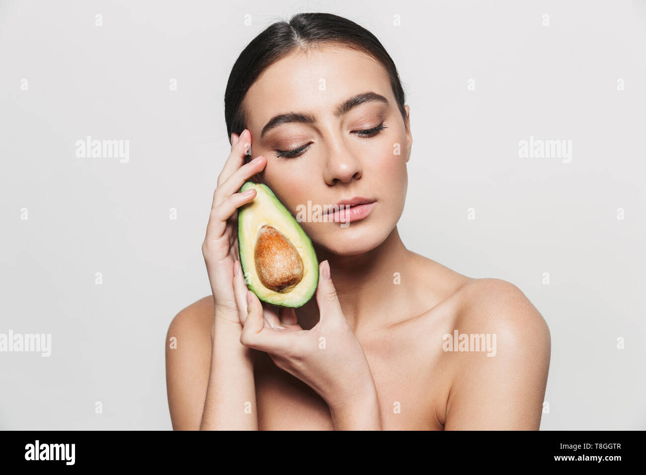 Beauty portrait of a young healthy attractive brunette woman standing ...