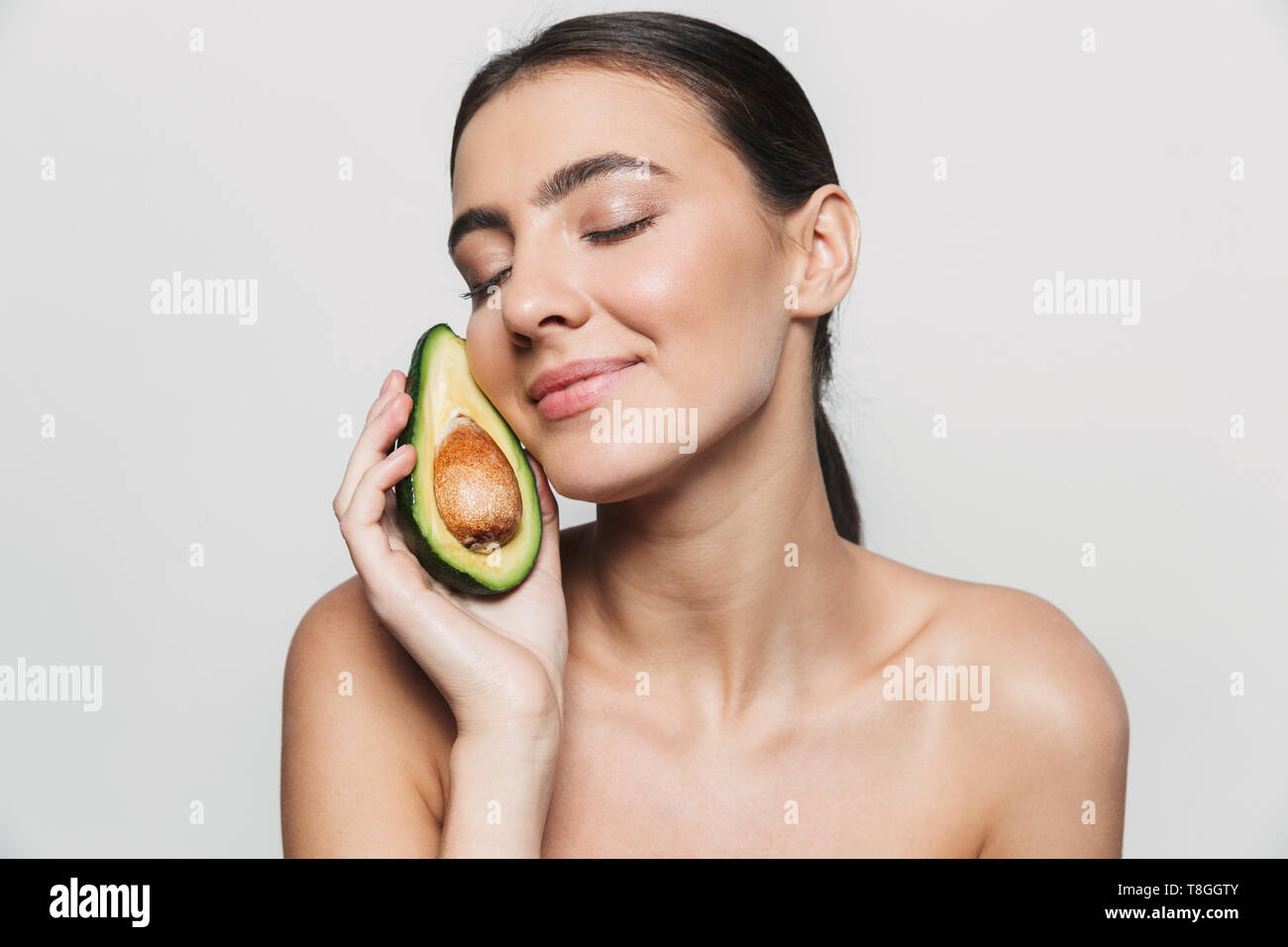 Beauty portrait of a young healthy attractive brunette woman standing ...