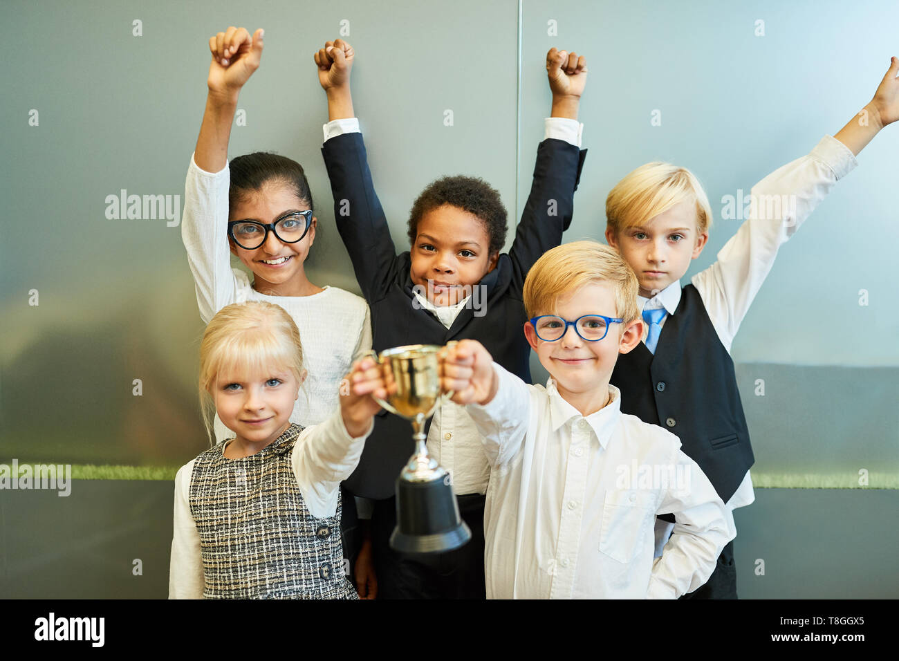 Children team celebration trophy hi-res stock photography and images ...