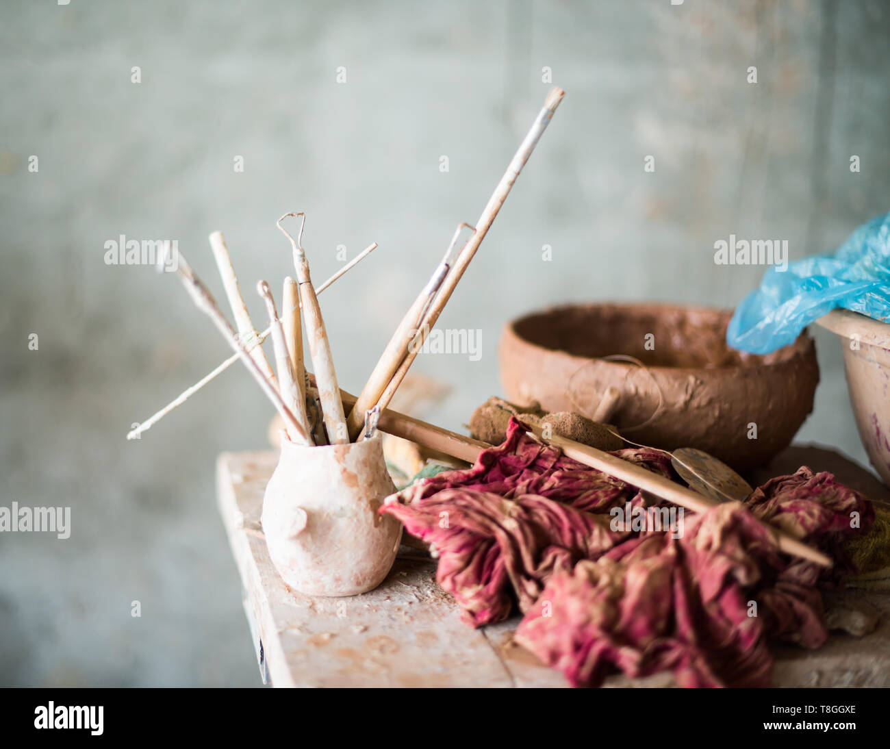 Ceramic artist workshop details, wet clay on messy table Stock Photo ...