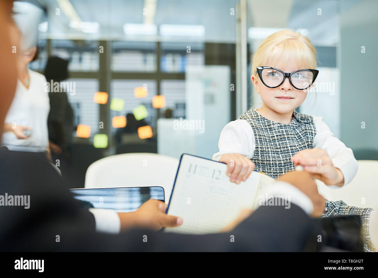 Girl as a secretary or businesswoman with calendar in scheduling in the ...
