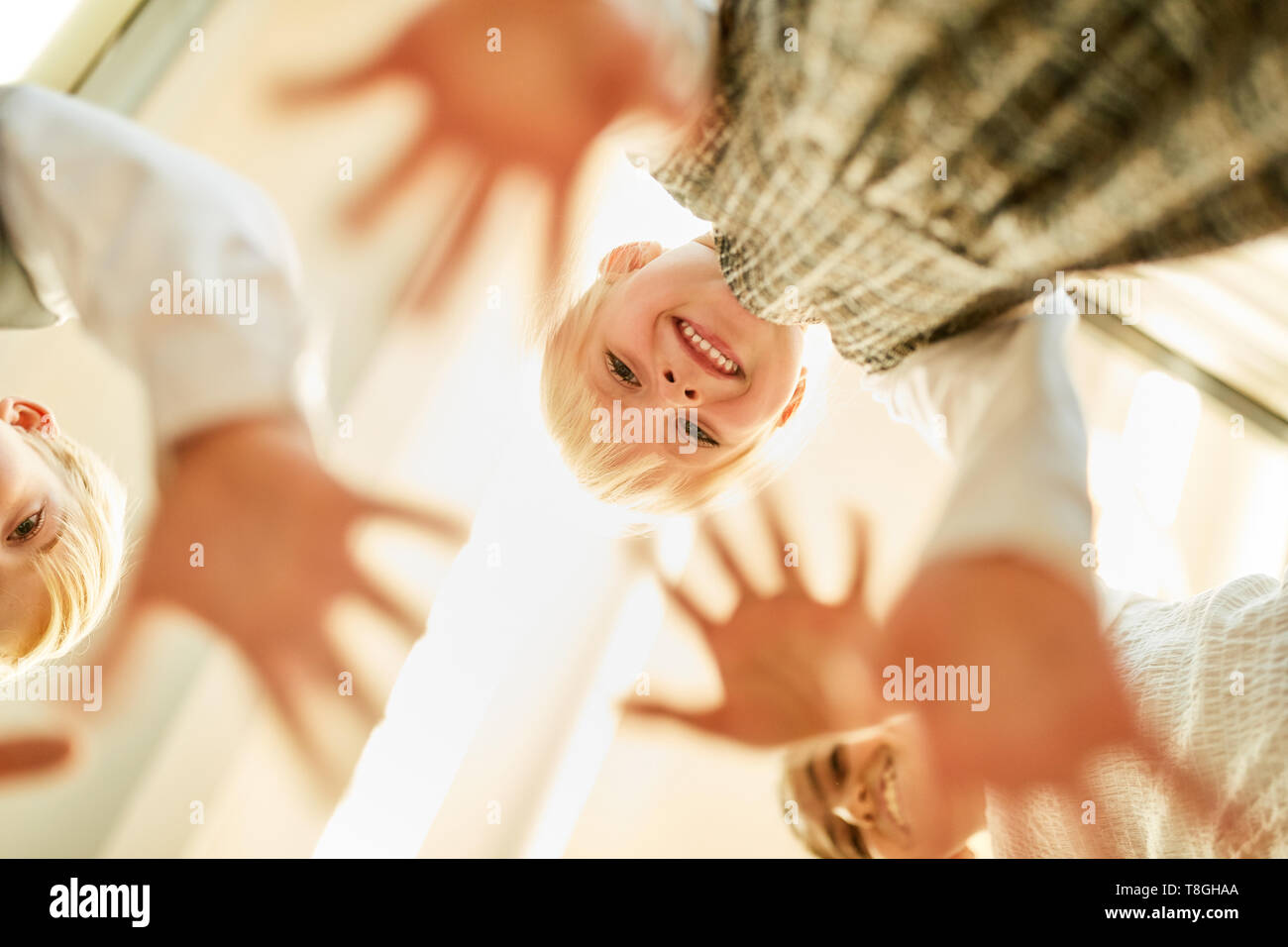 Children's hands waving while playing at the camera in kindergarten ...
