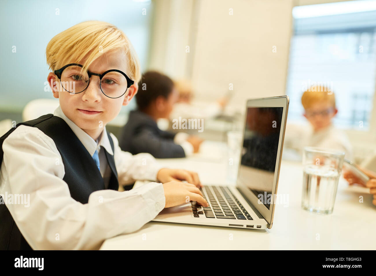 Child as a programmer or software developer at laptop Computer in the ...
