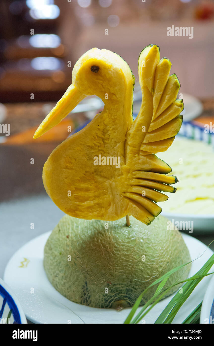 Carved melons decorate table at a buffet restaurant in Negril, Jamaica ...
