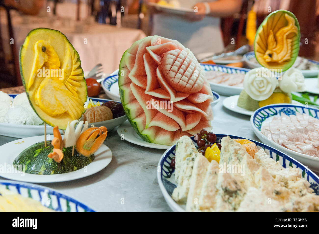 Carved melons decorate table at a buffet restaurant in Negril, Jamaica ...