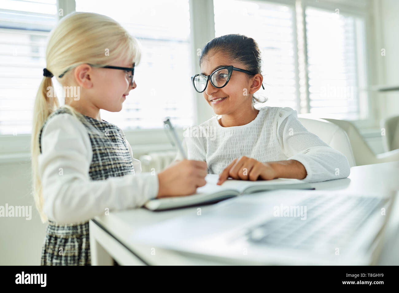 Two girls as business colleagues in scheduling together in the office ...