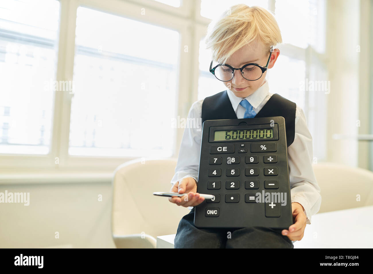 A student with a calculator hi-res stock photography and images - Alamy