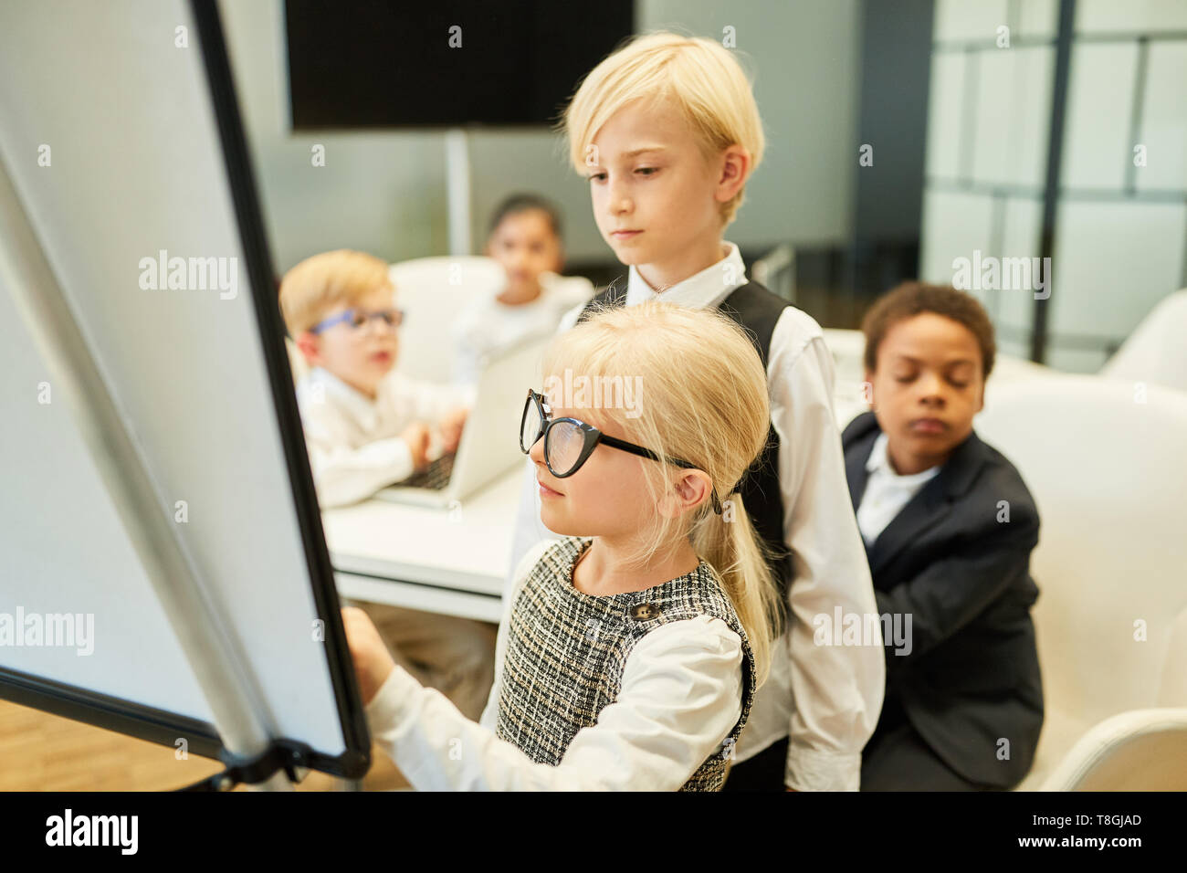 Children as business people work together in the project development ...