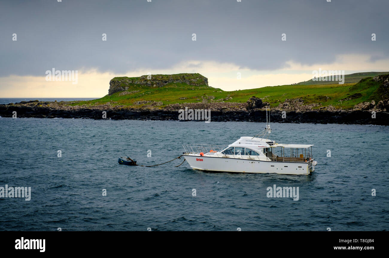 Small boat anchored off the island of Muck on the west coast of ...