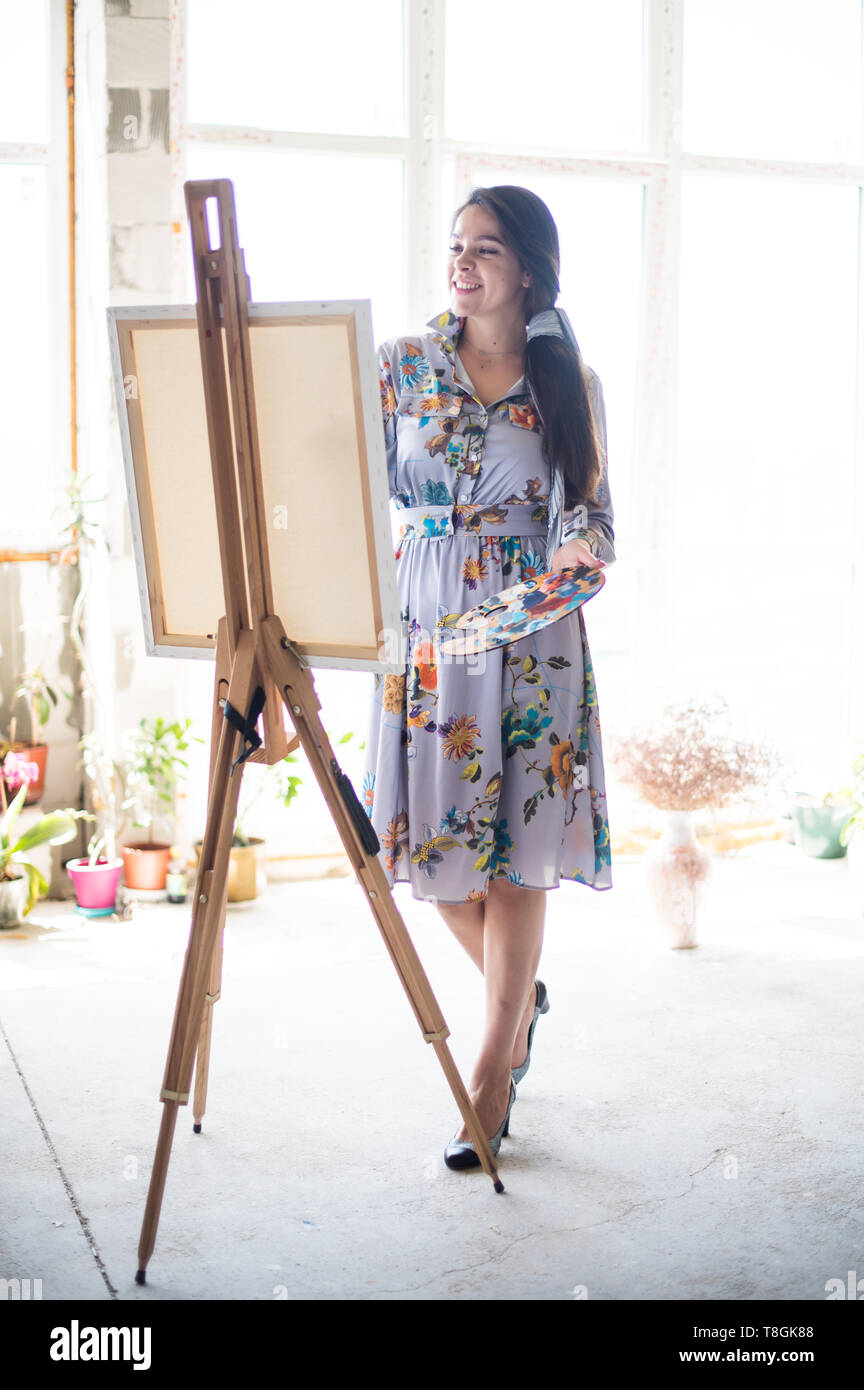 Young beautiful lady painter in dress, woman artist painting Stock ...