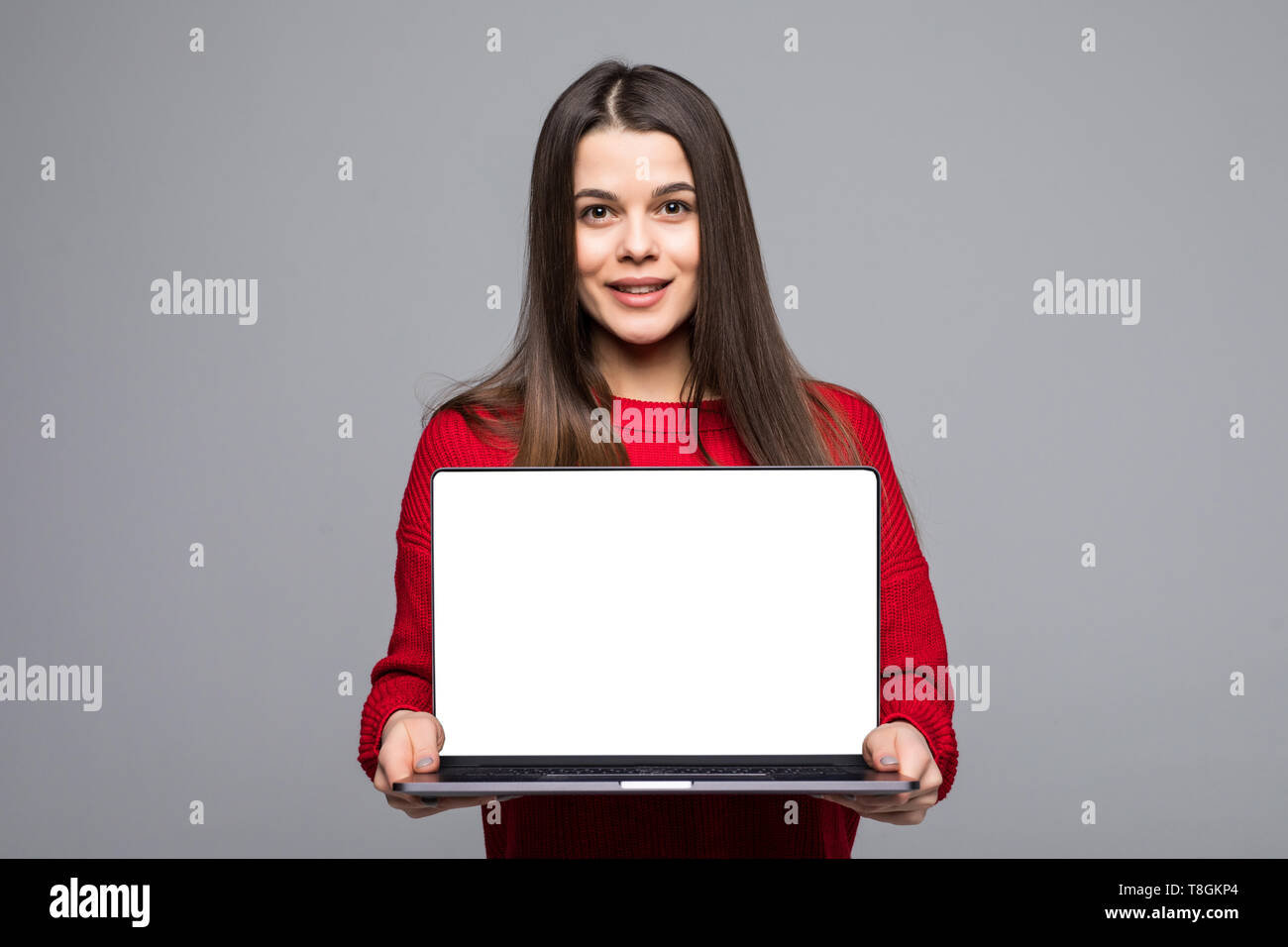 Portrait of a smiling woman dressed in red sweater and eyeglasses ...