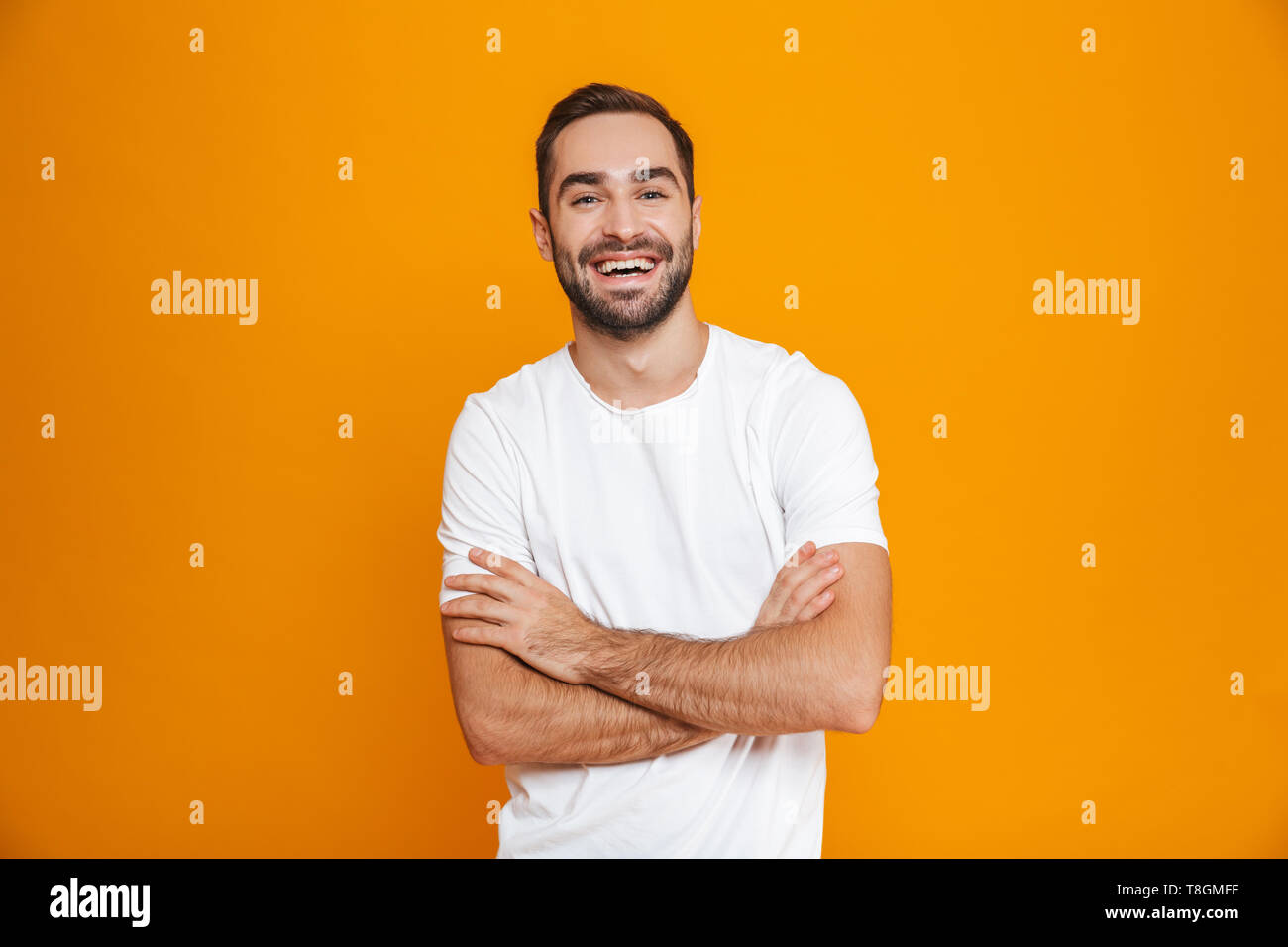 Image of brunette man 30s with beard and mustache smiling while ...