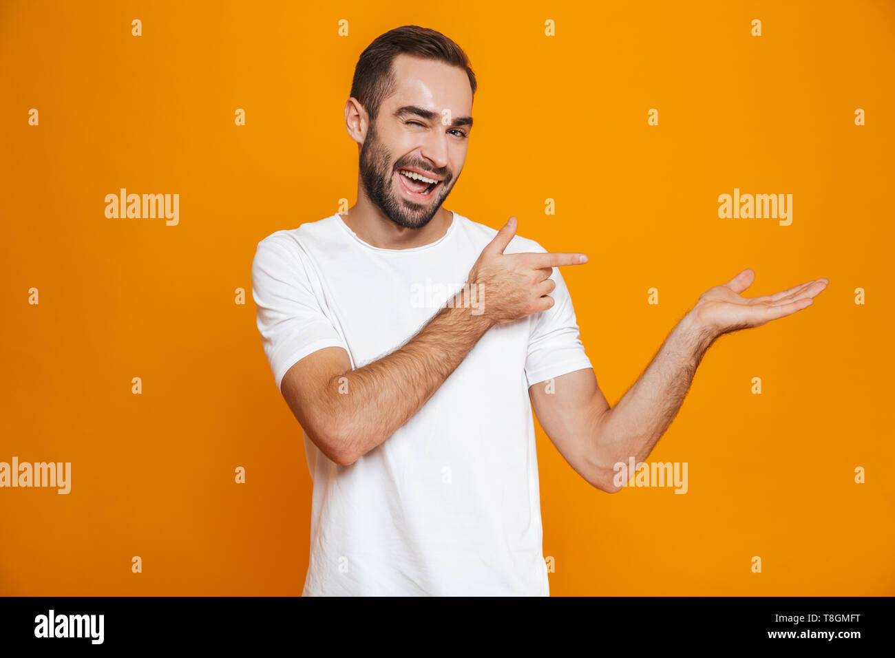 Image of good-looking man 30s with beard and mustache showing copyspace ...