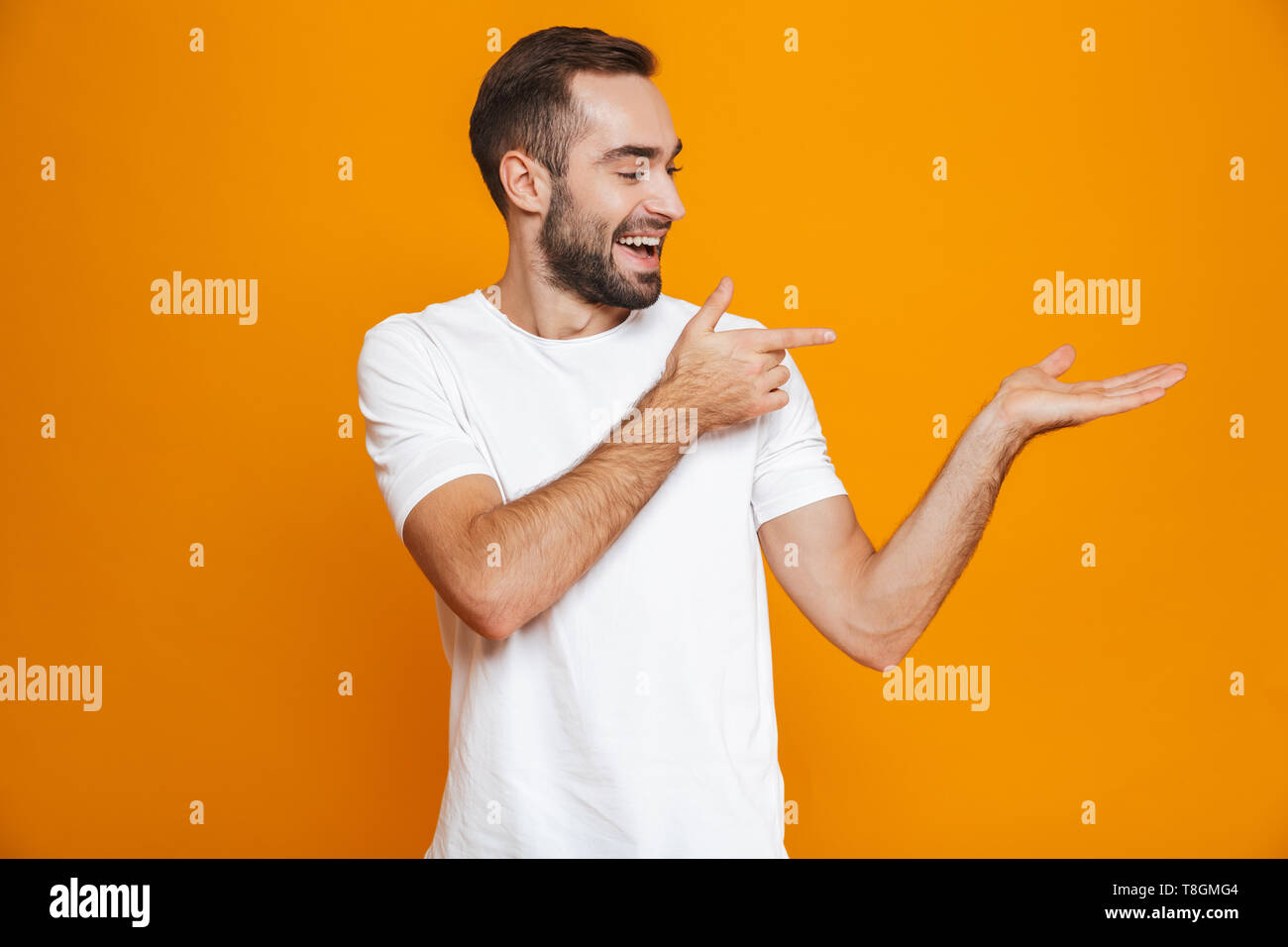 Image of caucasian man 30s with beard and mustache showing copyspace on ...