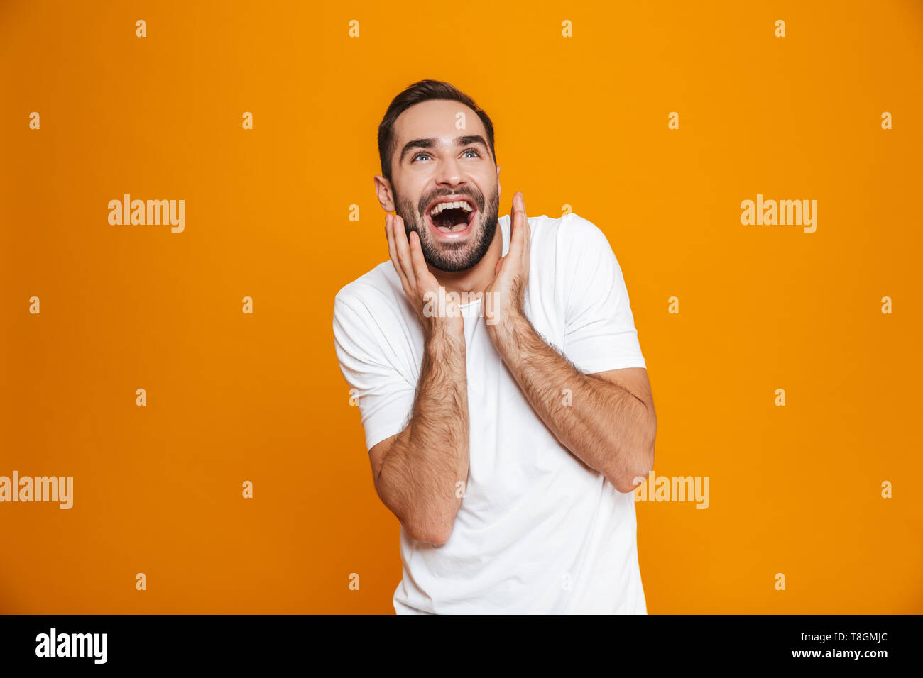 Image of happy man 30s with beard and mustache laughing while standing ...