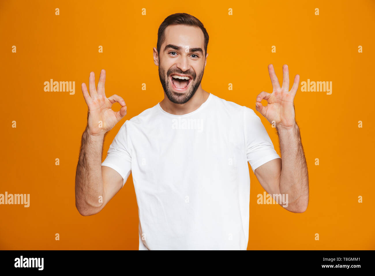 Image of joyful guy 30s with beard and mustache showing ok sign while ...