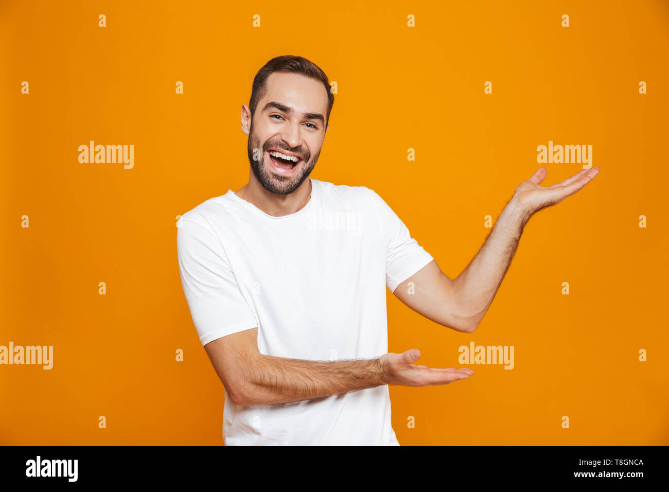 Image of cheerful guy 30s with beard and mustache showing copyspace on ...