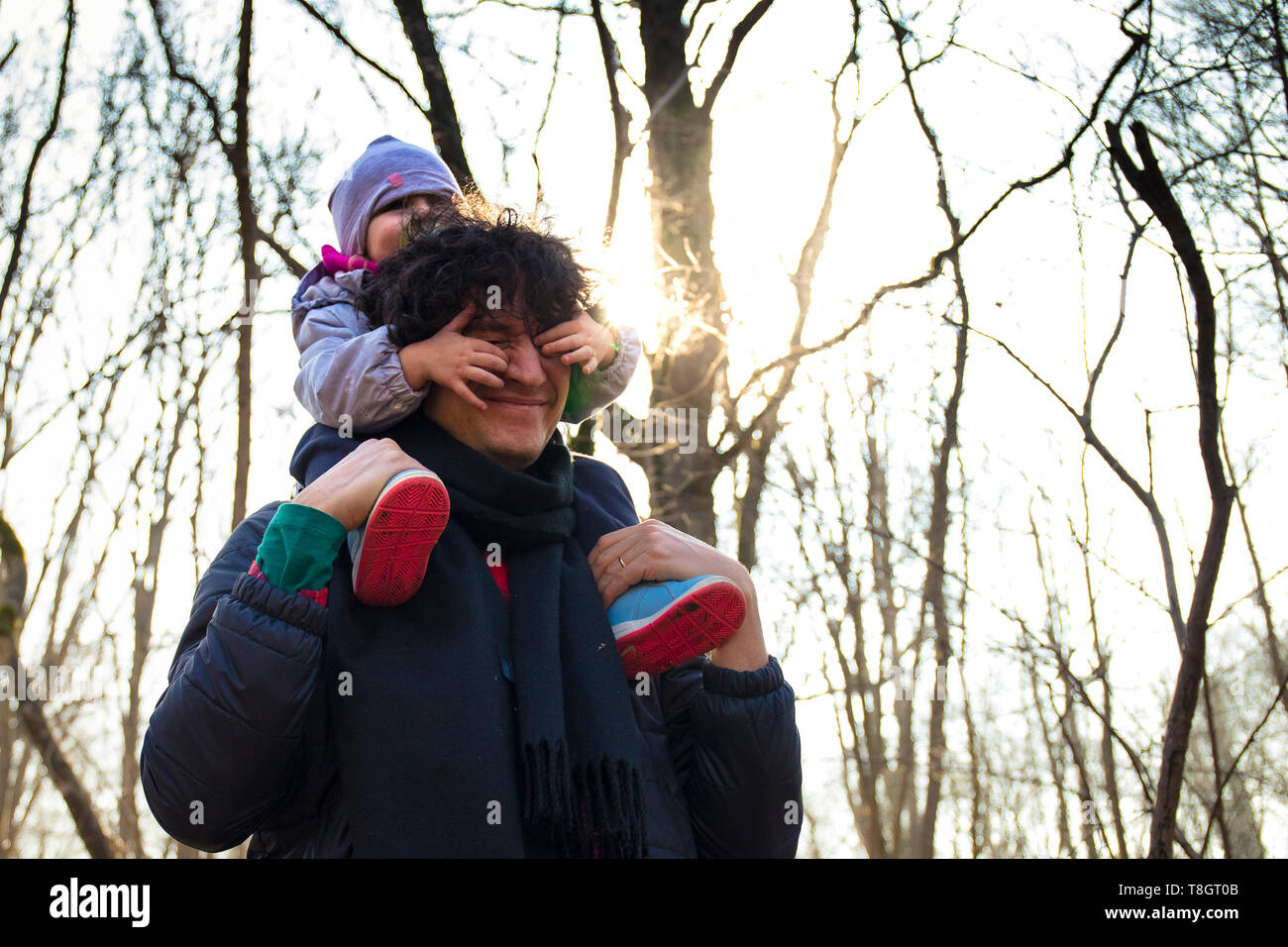 Child on dads shoulders hi-res stock photography and images - Alamy
