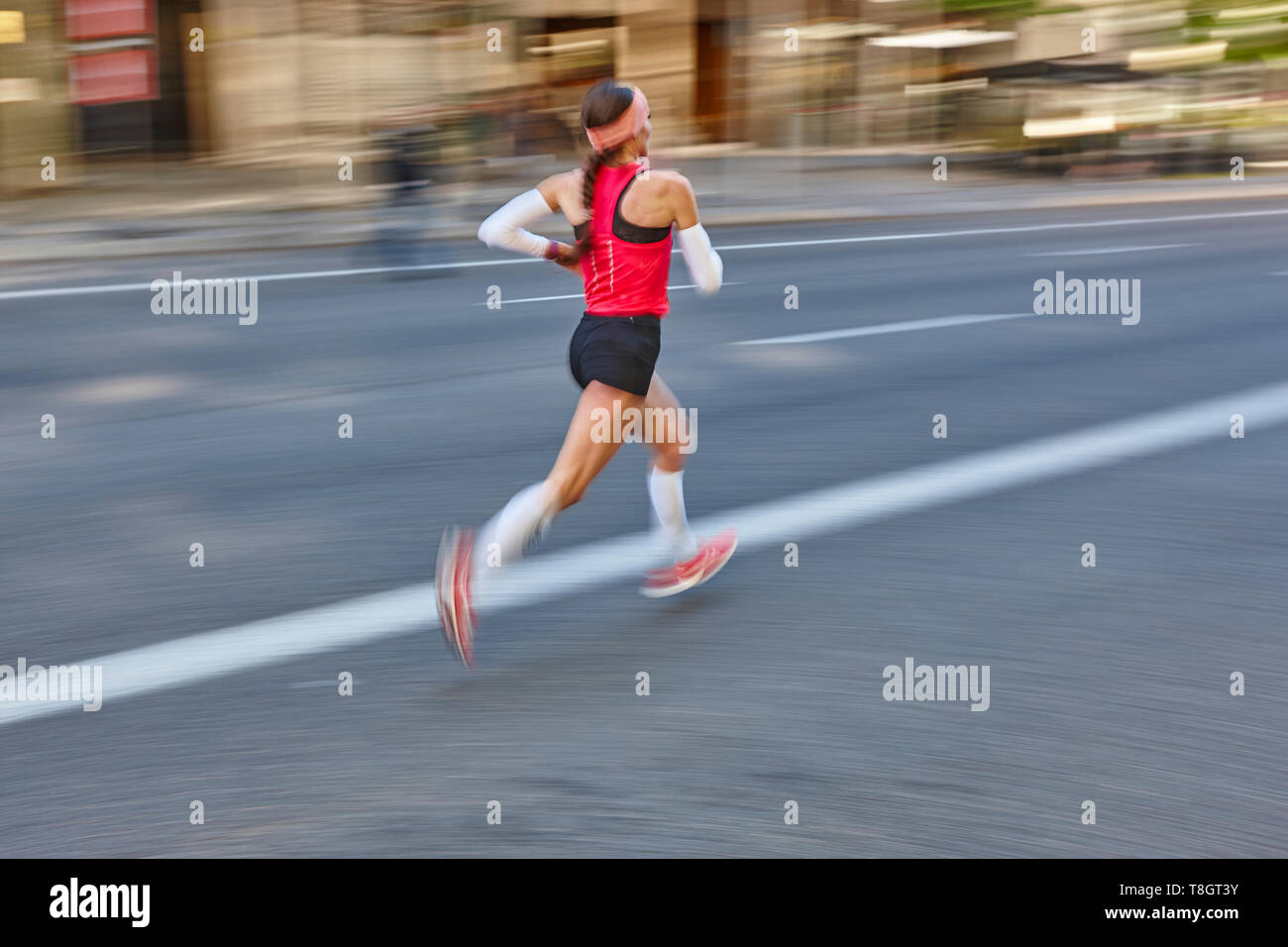 Marathon runner in motion on the street. Healthy lifestyle. Exercise ...