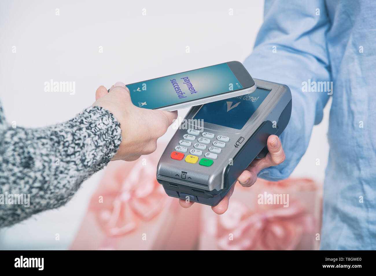 Making contactless payment with smart phone over payment terminal at ...